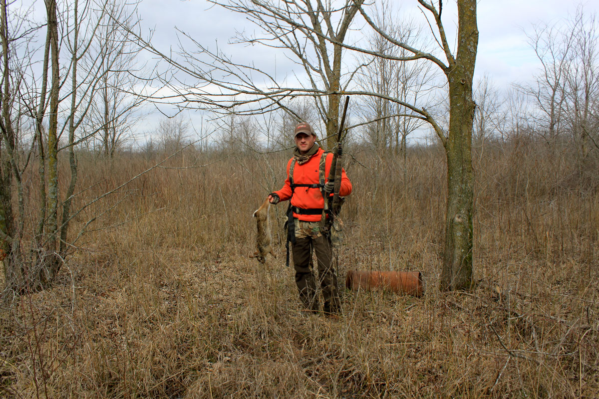 A hunter displays a delta swamp rabbit he killed thanks to the hard ...